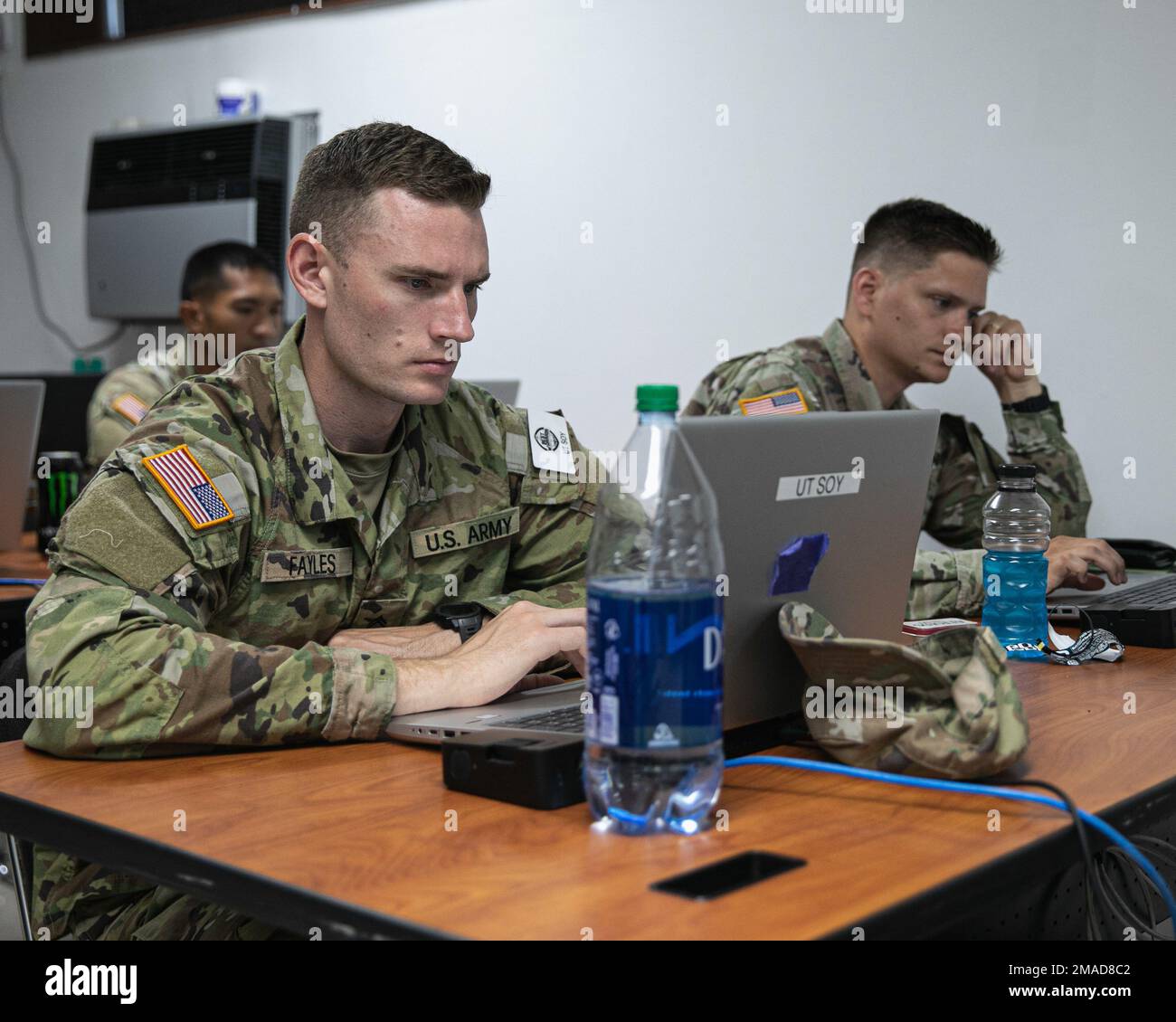 U.S. Army Cpl. Spencer Fayles (left) and Staff Sgt. Jackson Fagan ...