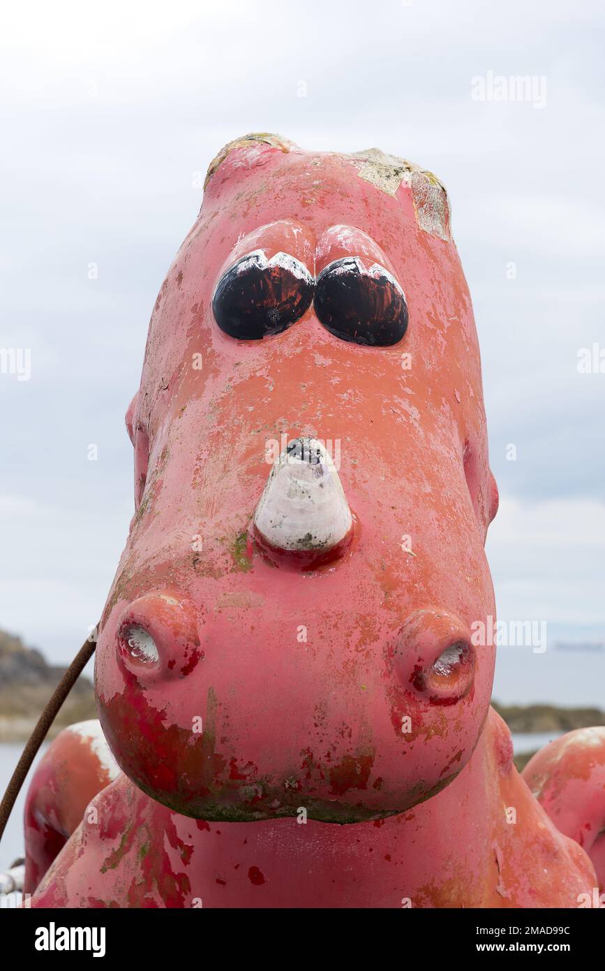 Large pink dragon model head close-up Mumbles pier Swansea Stock Photo ...