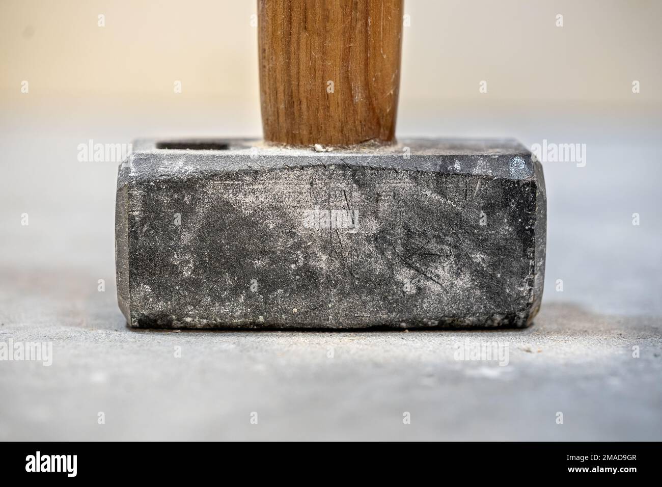 A closeup shot of a sledgehammer with shallow depth of field on a ...