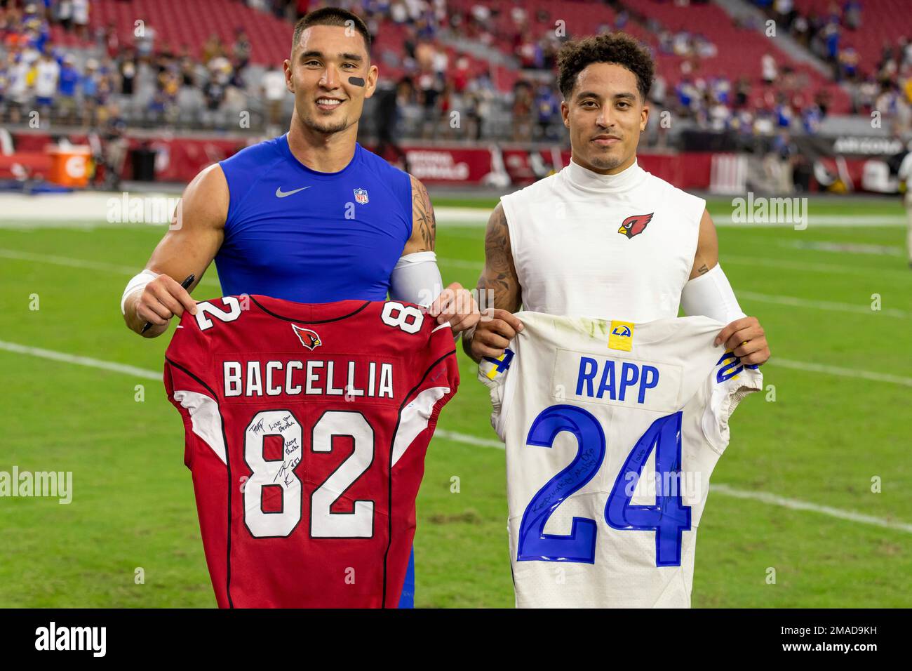 Safety (24) Taylor Rapp of the Los Angeles Rams swaps jerseys with Wide ...