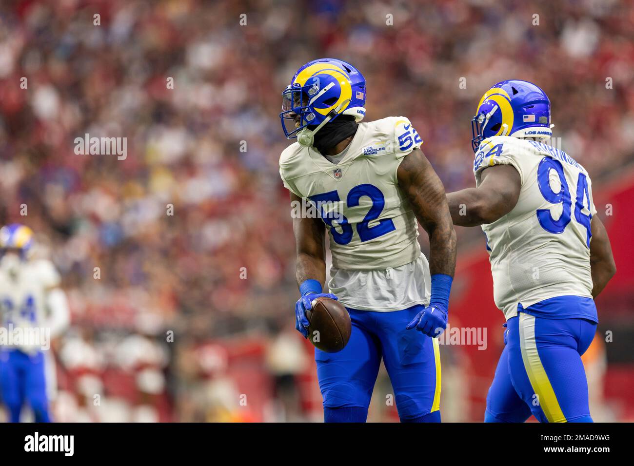 Linebacker (52) Terrell Lewis of the Los Angeles Rams picks up a loose ...