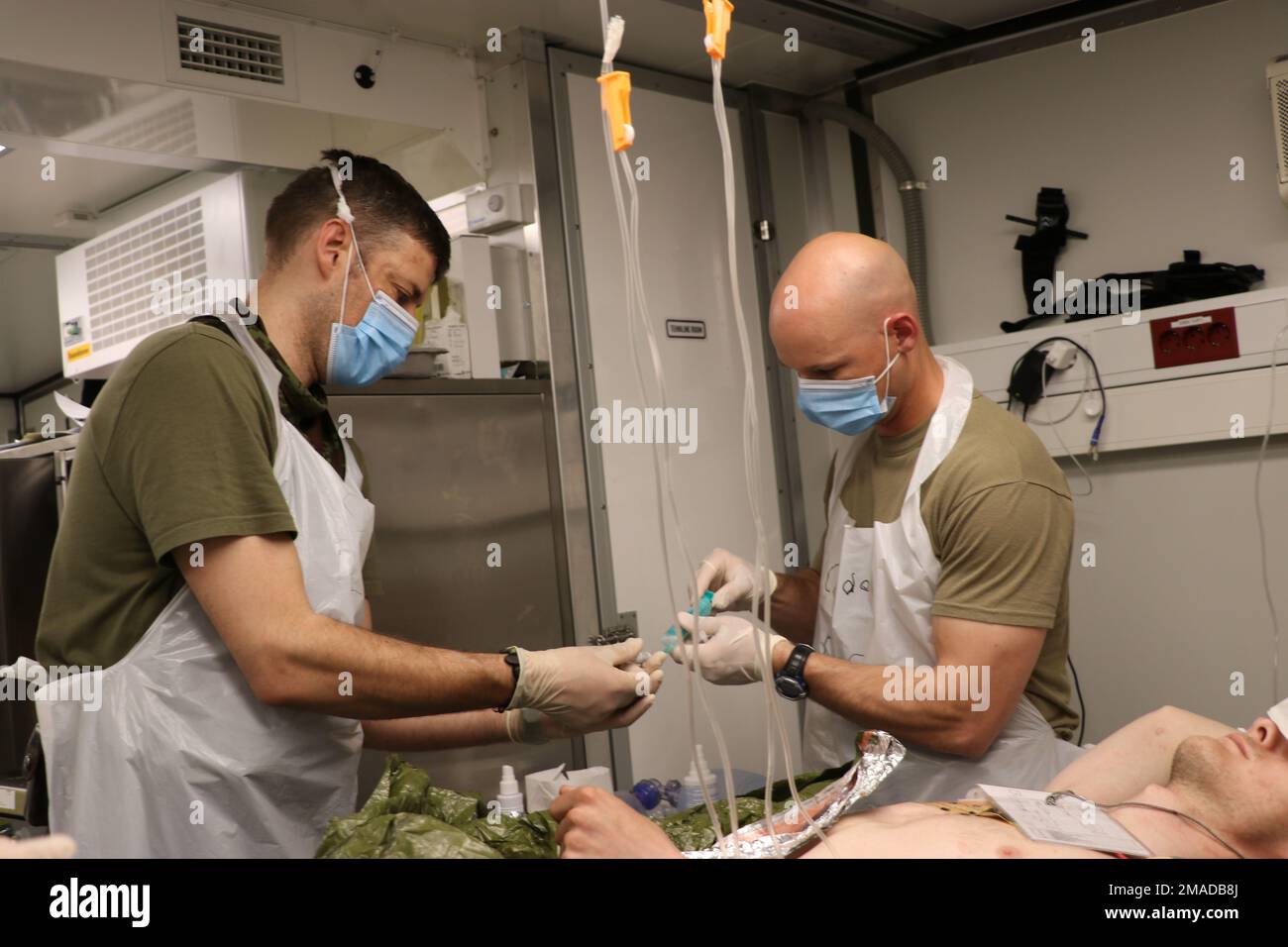 Estonian nurse Ilmar Solom and U.S. Army Maj. Cordell Hachinsky ...