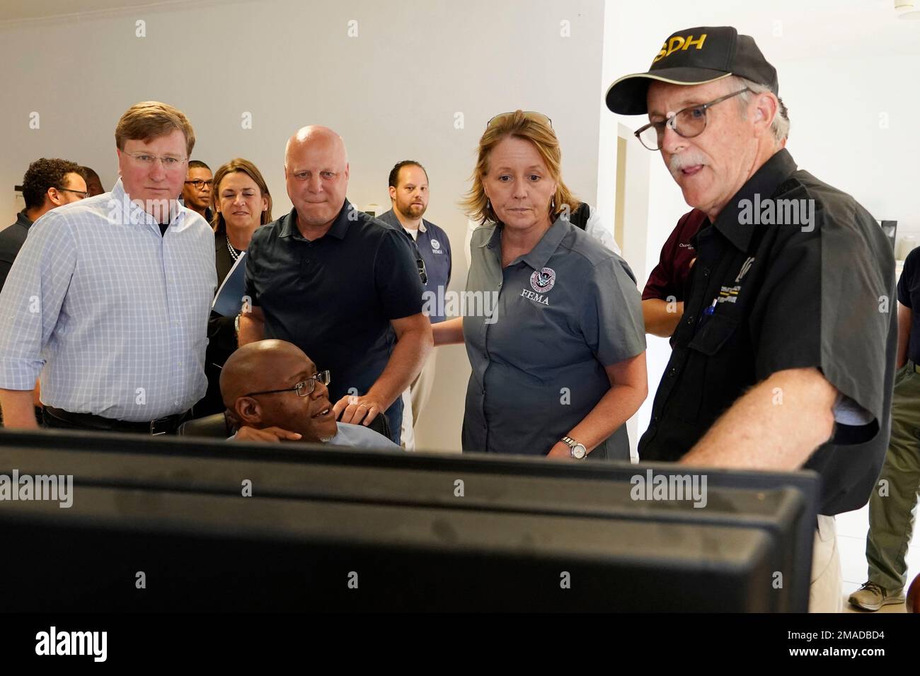 Jim Craig, with the Mississippi State Department of Health, right ...