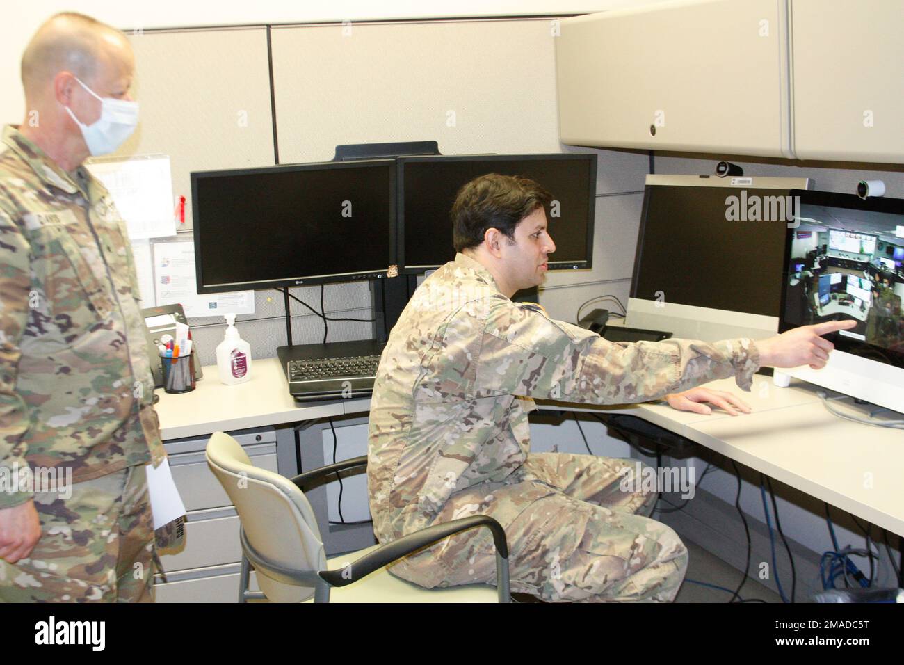Army Maj. (Dr.) Nikhil Huprikar (seated), chief of Pulmonary and ...