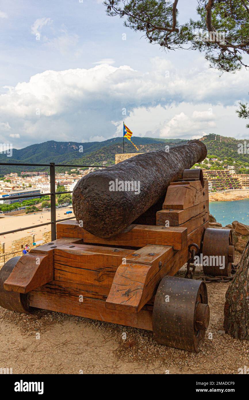 Canon on the ramparts of the medieval castle at Toassa de Maer, Spain ...
