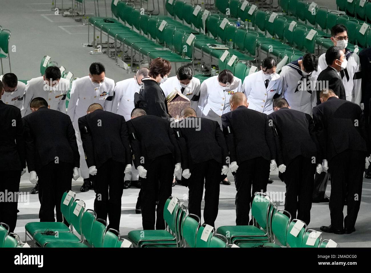 Akie Abe, wife of former Japanese Prime Minister Shinzo Abe, carries ...