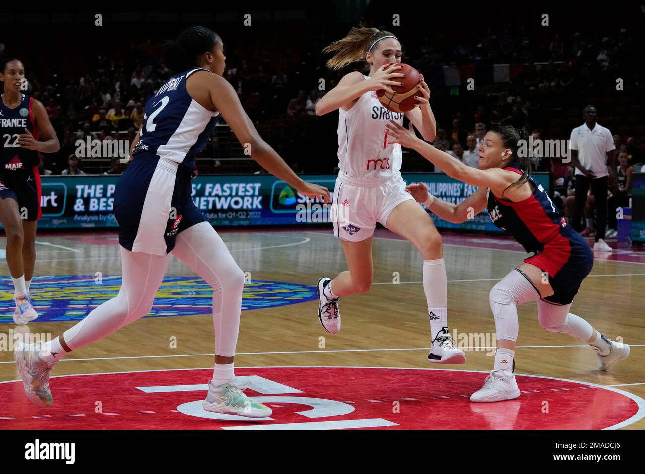 Serbia's Ivana Raca, centre, runs between France's Iliana Rupert, left ...