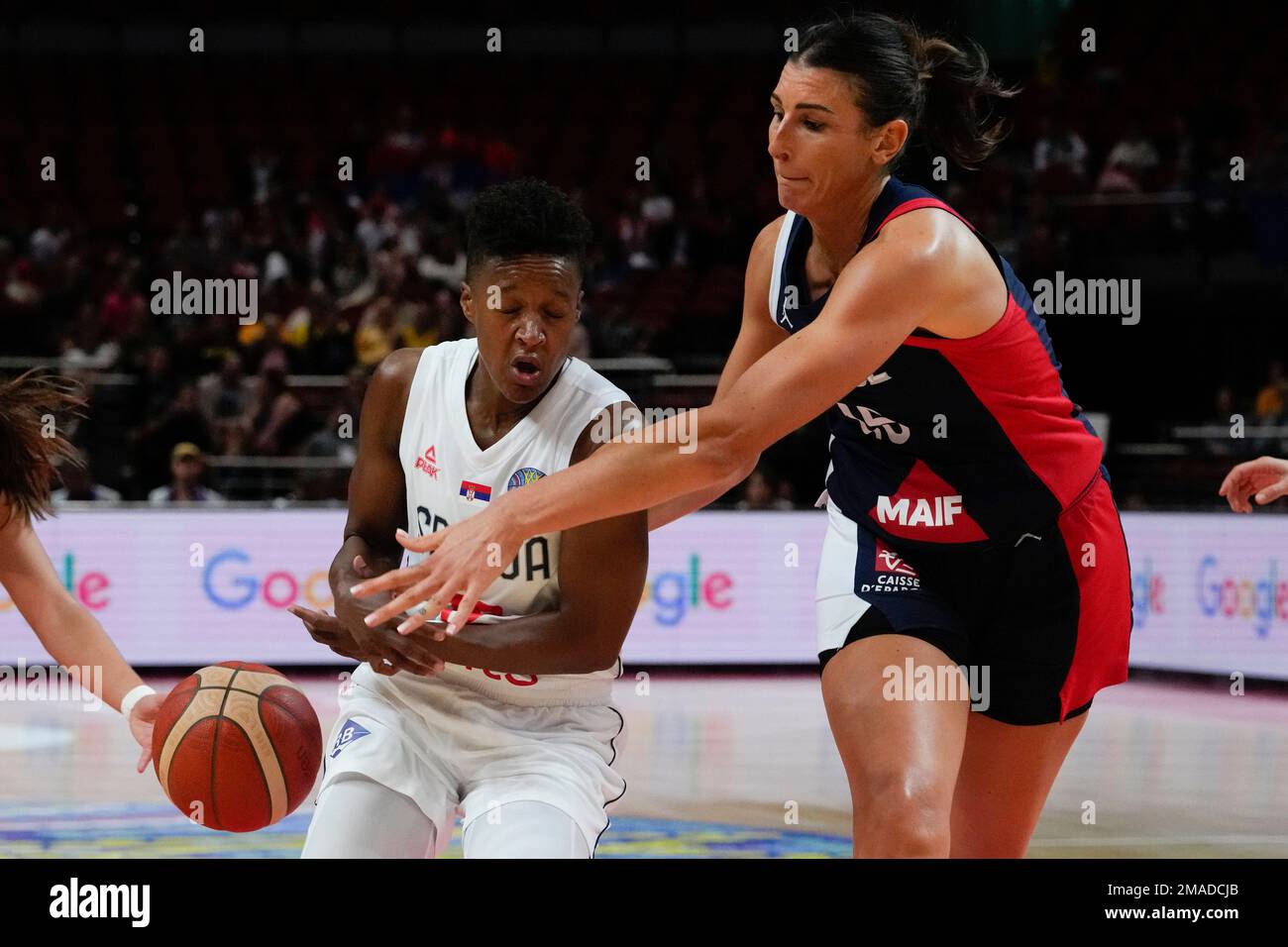 France's Helena Ciak, right, knocks the ball out of the hands of Serbia ...