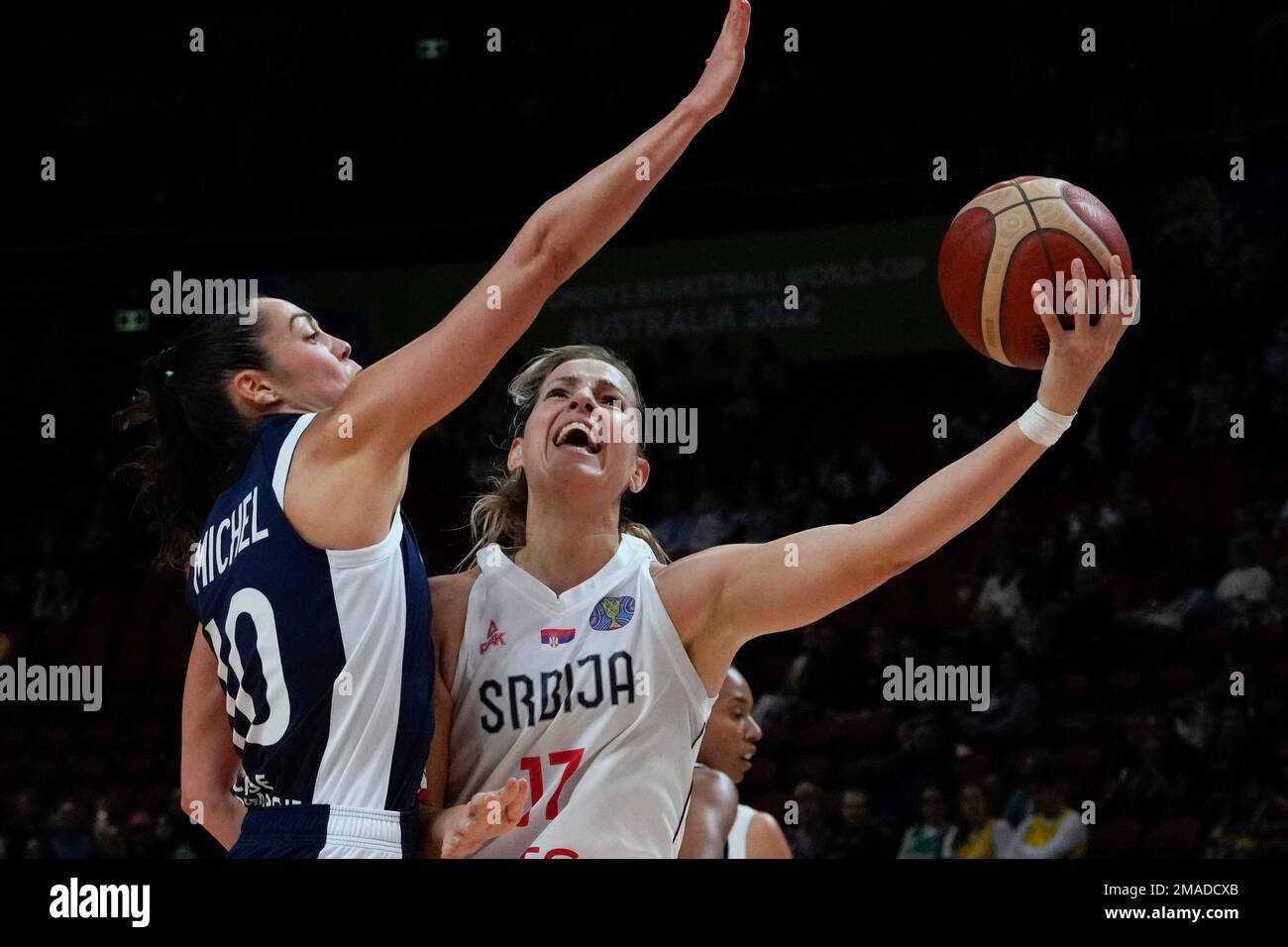 Serbia's Jovana Nogic takes a shot at goal a France's Sarah Michel ...