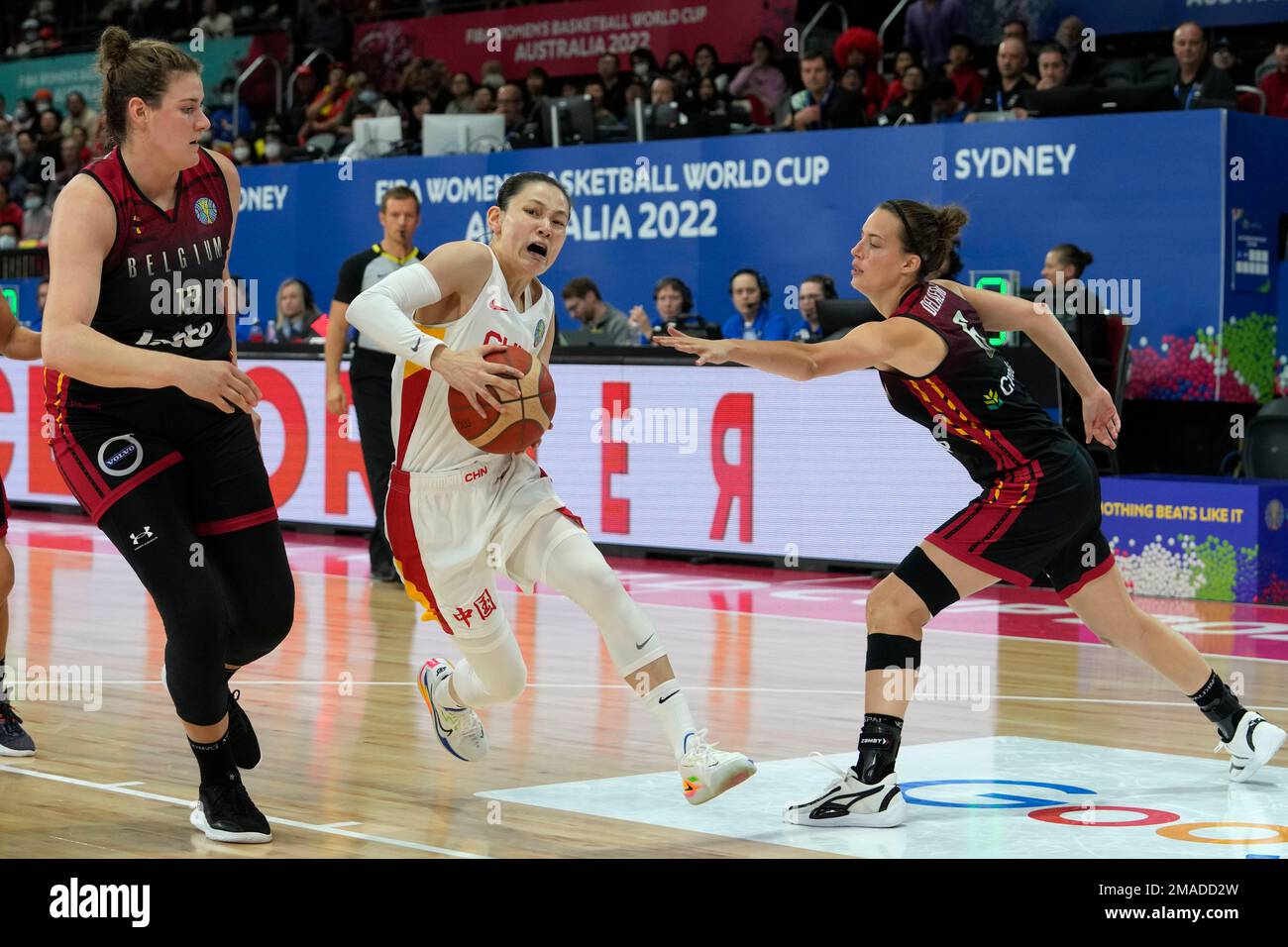 China's Yang Liwei, center, goes between Belgium's Kyara Linskens, left ...