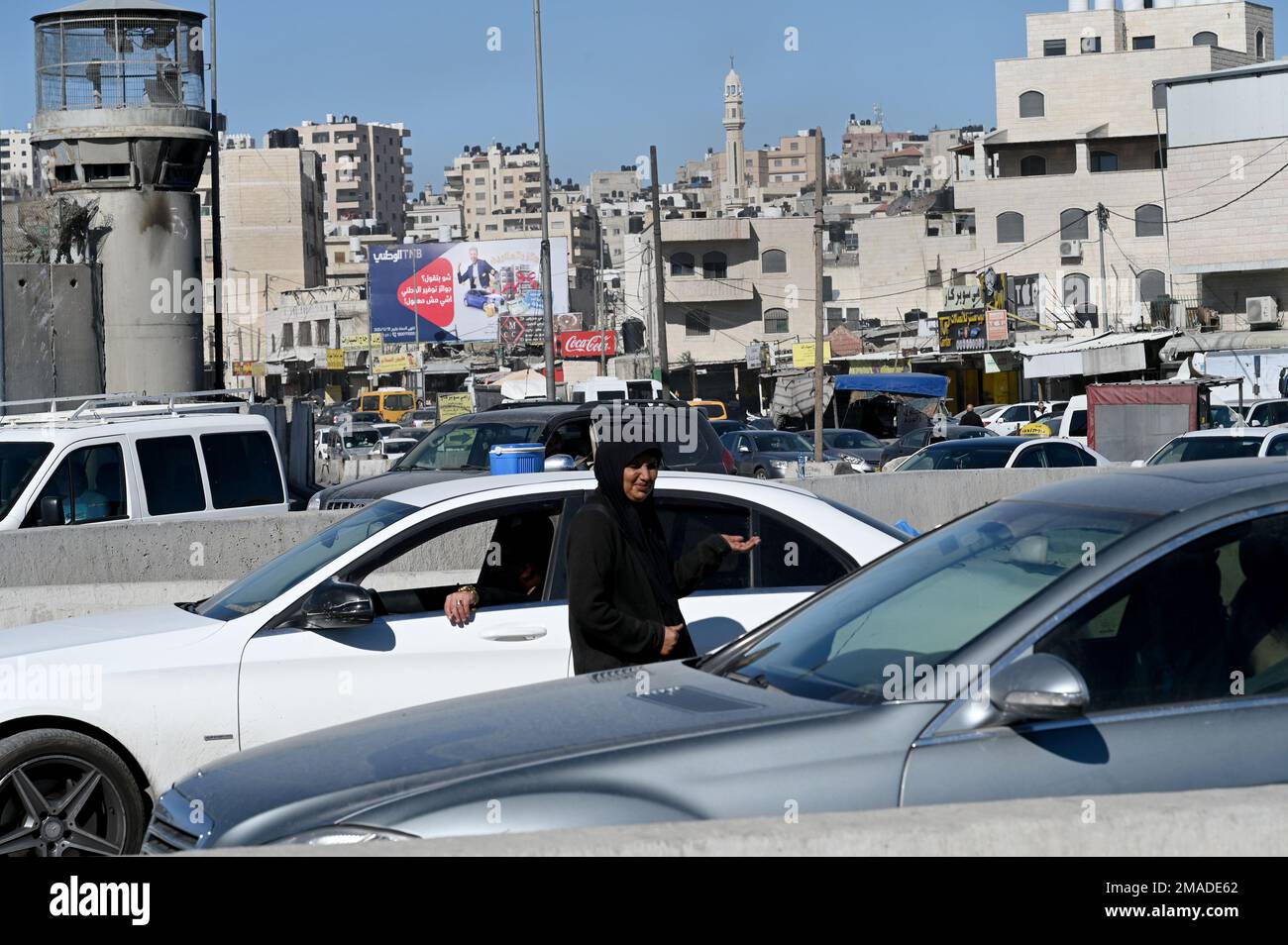 Qalandiya Checkpoint, West Bank. 19th Jan, 2023. A Palestinian woman ...
