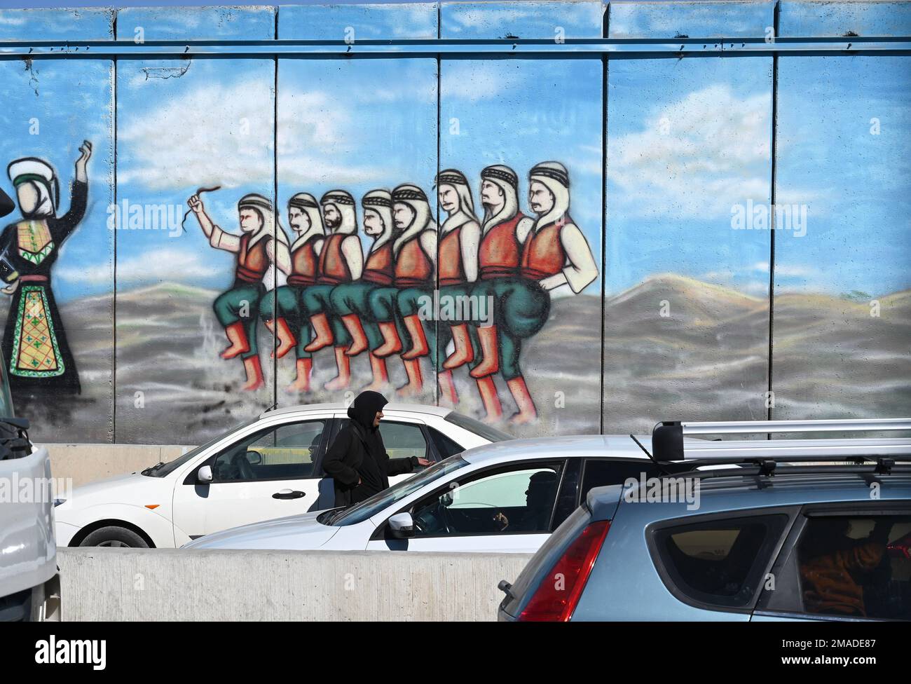Qalandiya Checkpoint, West Bank. 19th Jan, 2023. A Palestinian begs ...