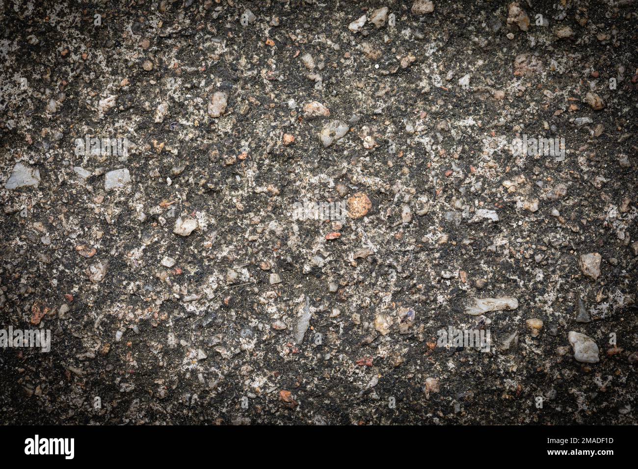 Gray textured cement wall background with fine concrete chips ...