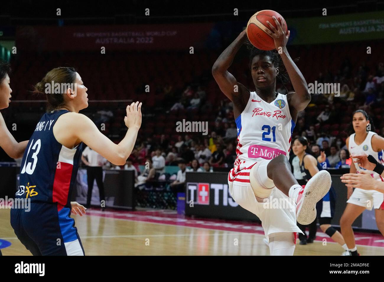 Puerto Rico's Mya Hollingshed regathers the ball as South Korea's Yang ...