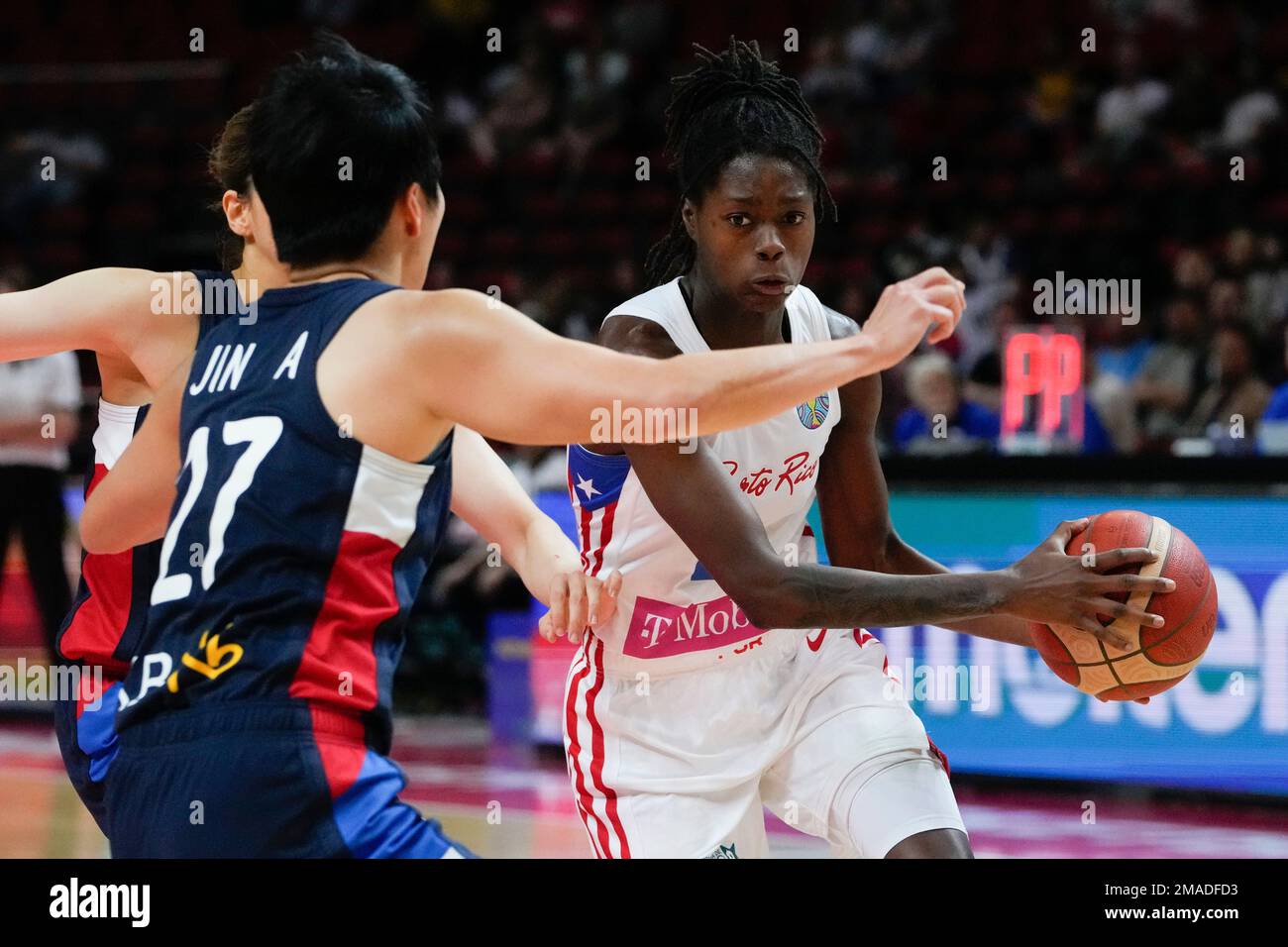 Puerto Rico's Mya Hollingshed runs at South Korea's Jin An during their ...