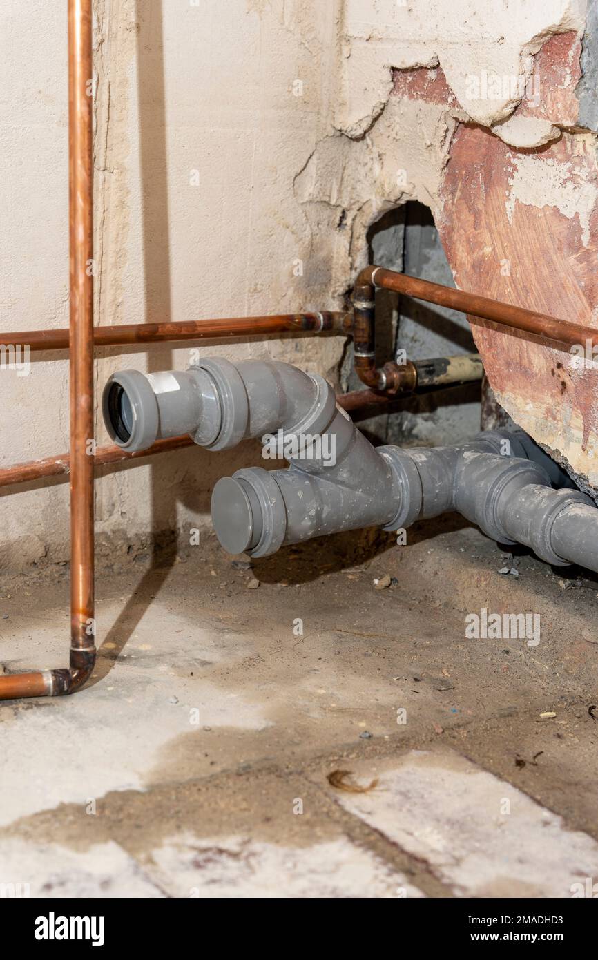 Wiring of plastic sewer pipes. Home renovation Stock Photo - Alamy