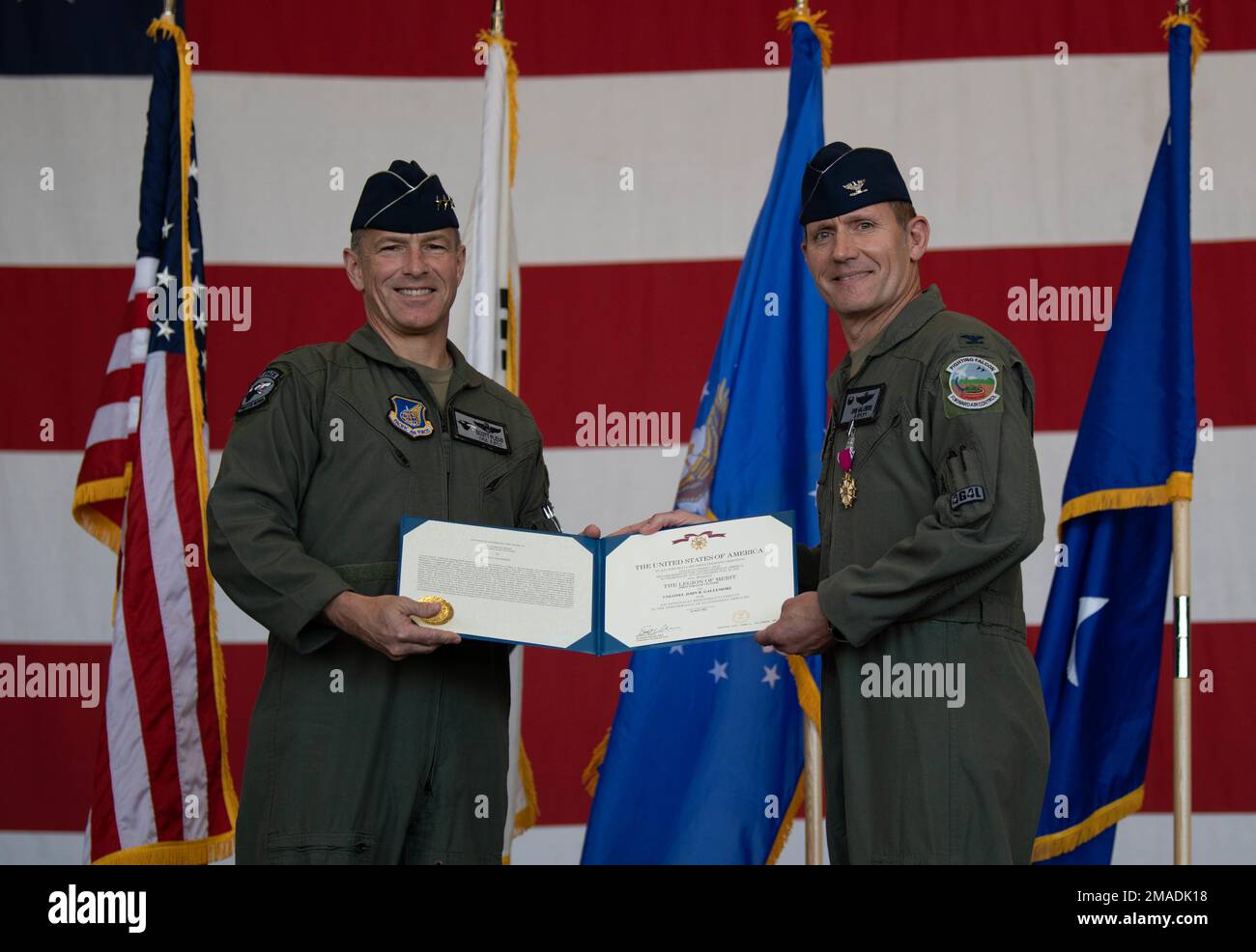 Lt. Gen. Scott Pleus, Seventh Air Force commander, presents the Legion ...