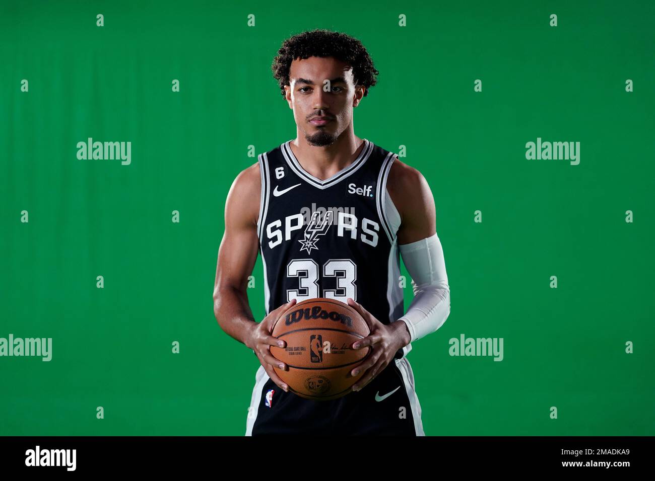 San Antonio Spurs guard Tre Jones (33) poses for photos during the team ...