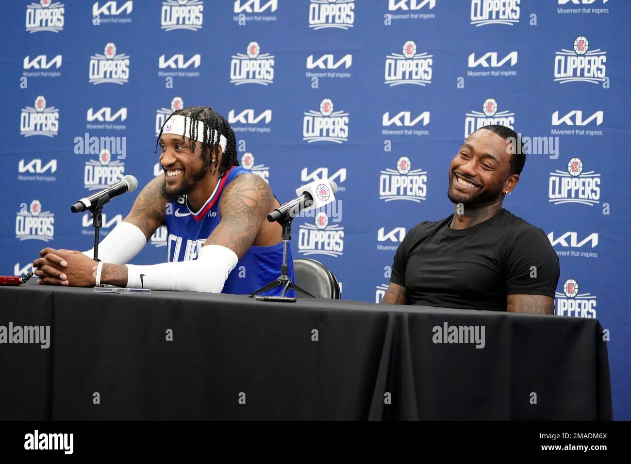 Los Angeles Clippers' John Wall, right, and Robert Covington smile as ...