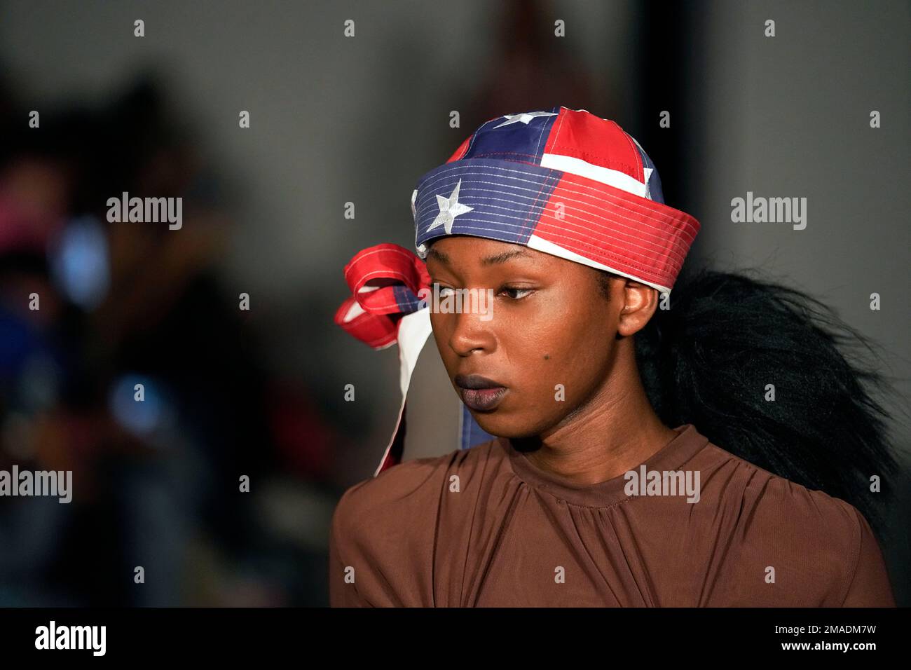 A model wears a creation by designers Patric DiCaprio and Bryn ...