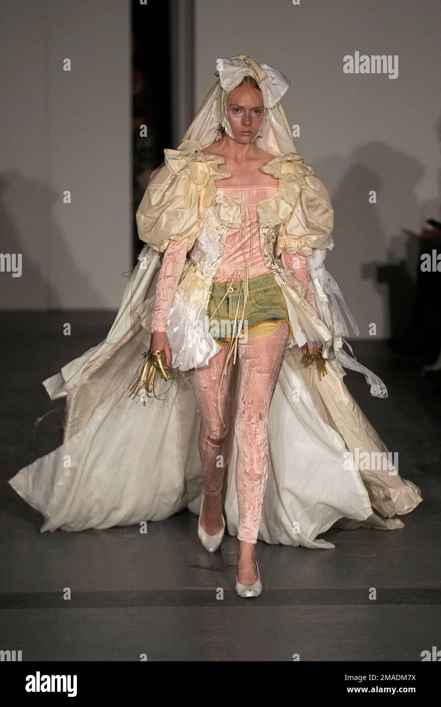 A model wears a creation by designers Patric DiCaprio and Bryn ...