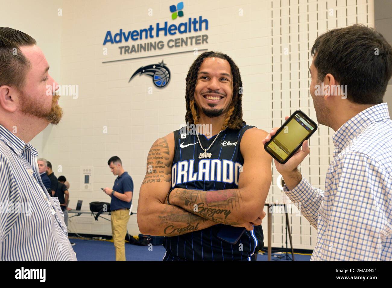 Orlando Magic guard Cole Anthony, center, answers questions from ...