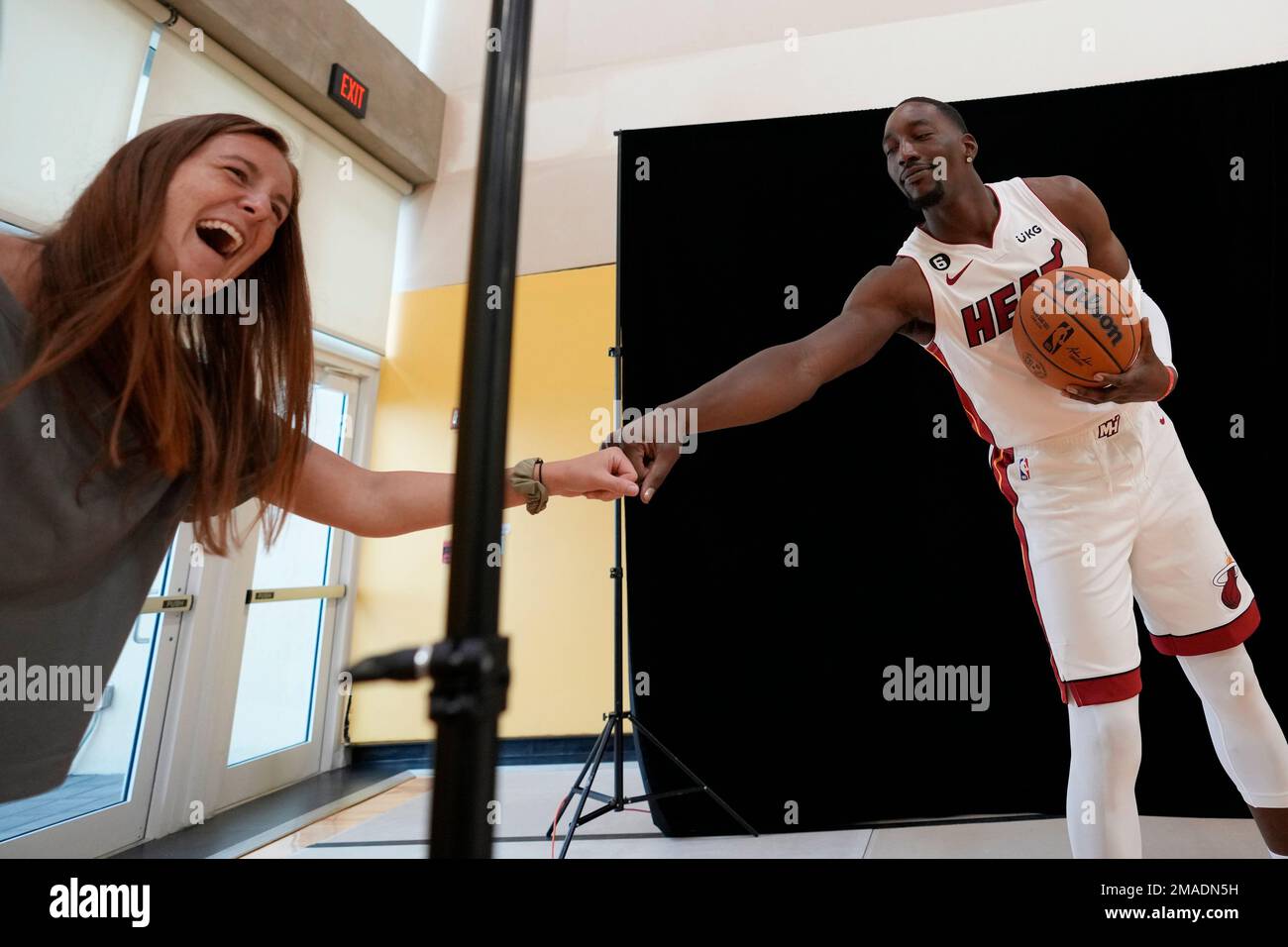 Miami Heat's Bam Adebayo, right, fist bumps Megan Briggs of Getty ...