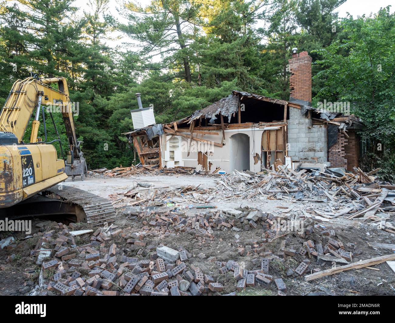 House under Demolition: A large ranch style house partially demolished ...