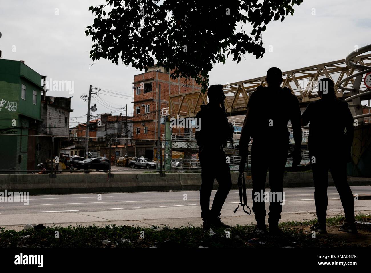 Police patrol the Complexo da Mare favela during an operation targeting ...