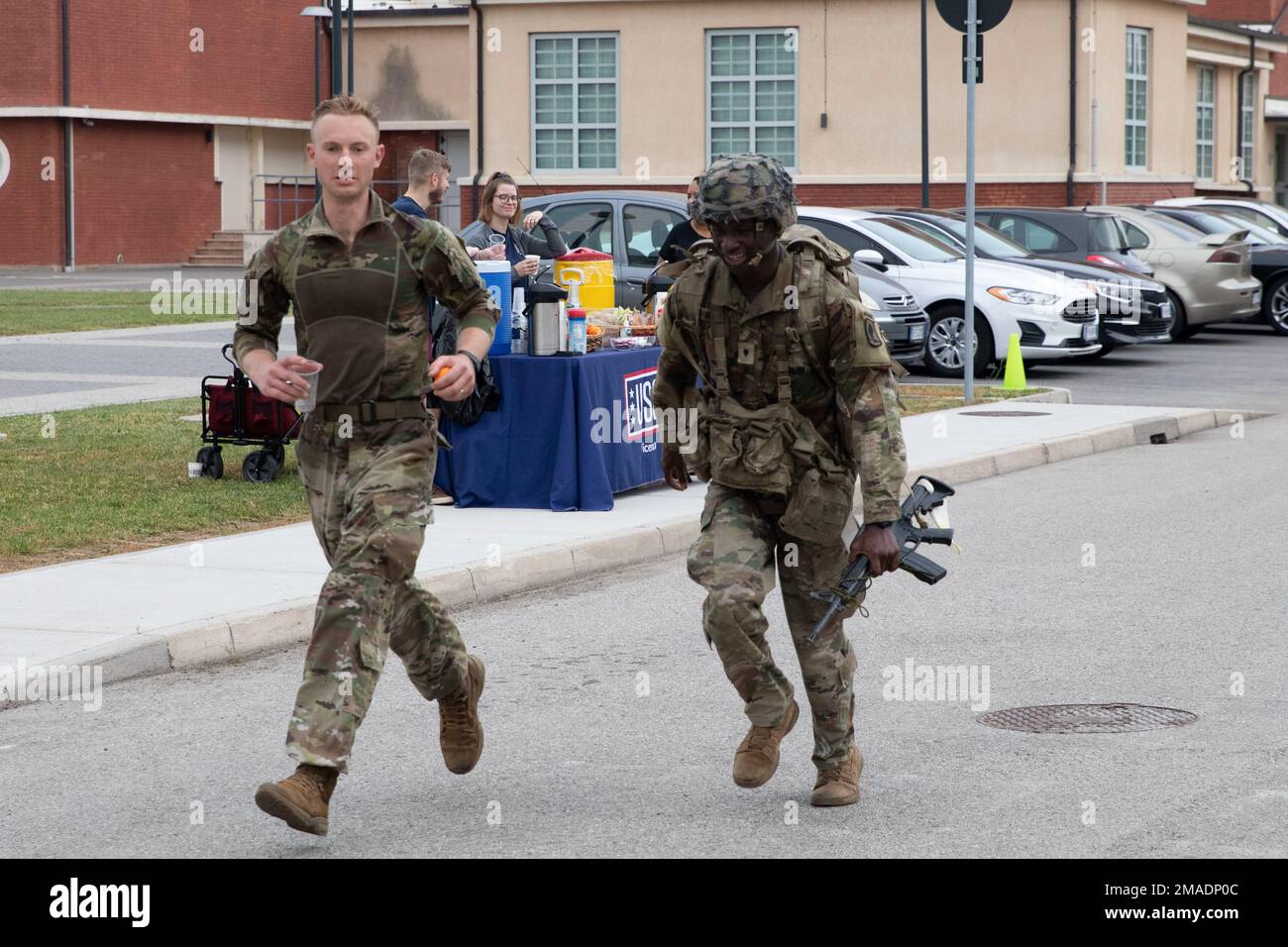 After finishing the ruck march, 2nd Lt. Lawrence Mixon motivates Spc ...