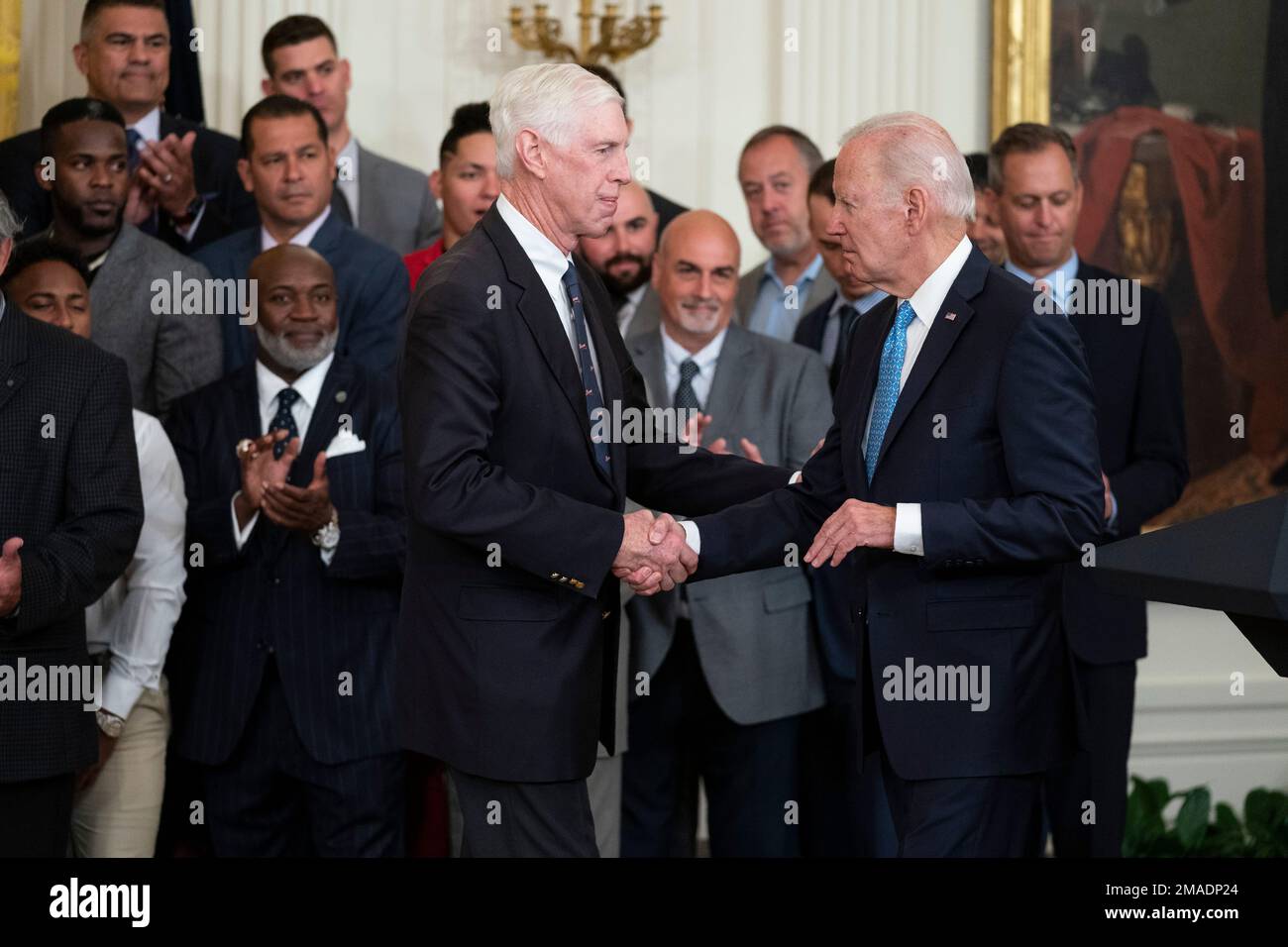 President Joe Biden shakes hands with Atlanta Braves President and CEO ...