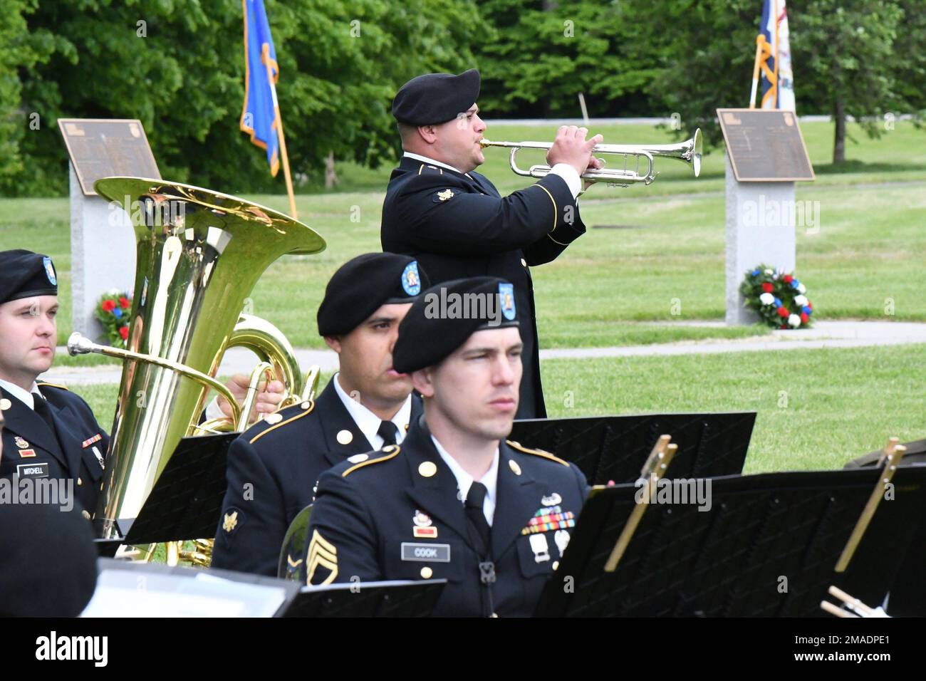 A Soldier from the 10th Mountain Division Band plays “Taps” at the ...