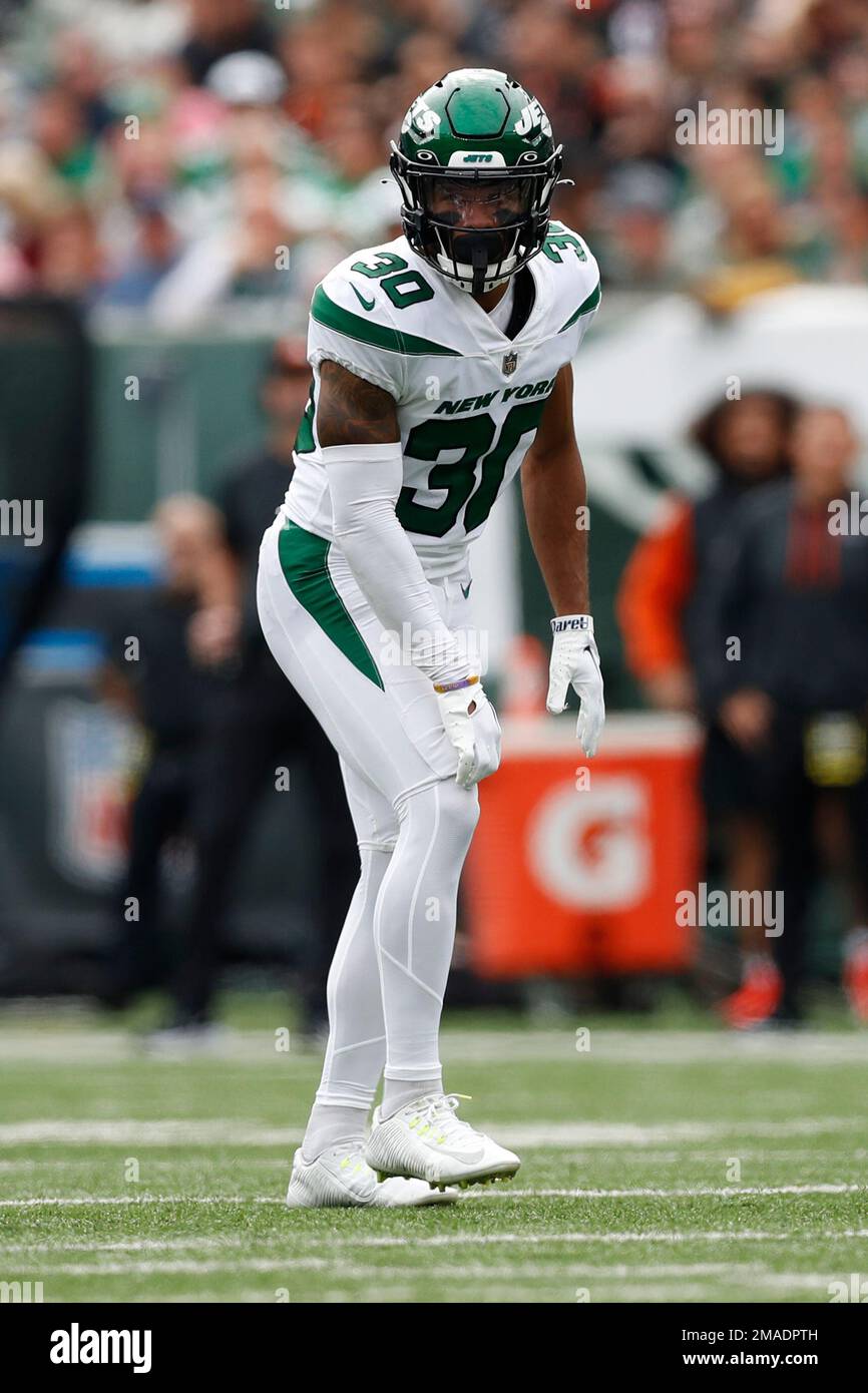 New York Jets cornerback Michael Carter II (30) looks out over the line ...