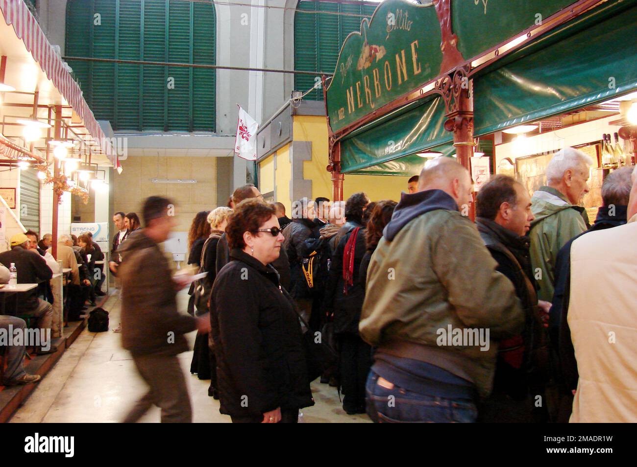 People are queuing at a cafe at the local market at lunchtime in ...