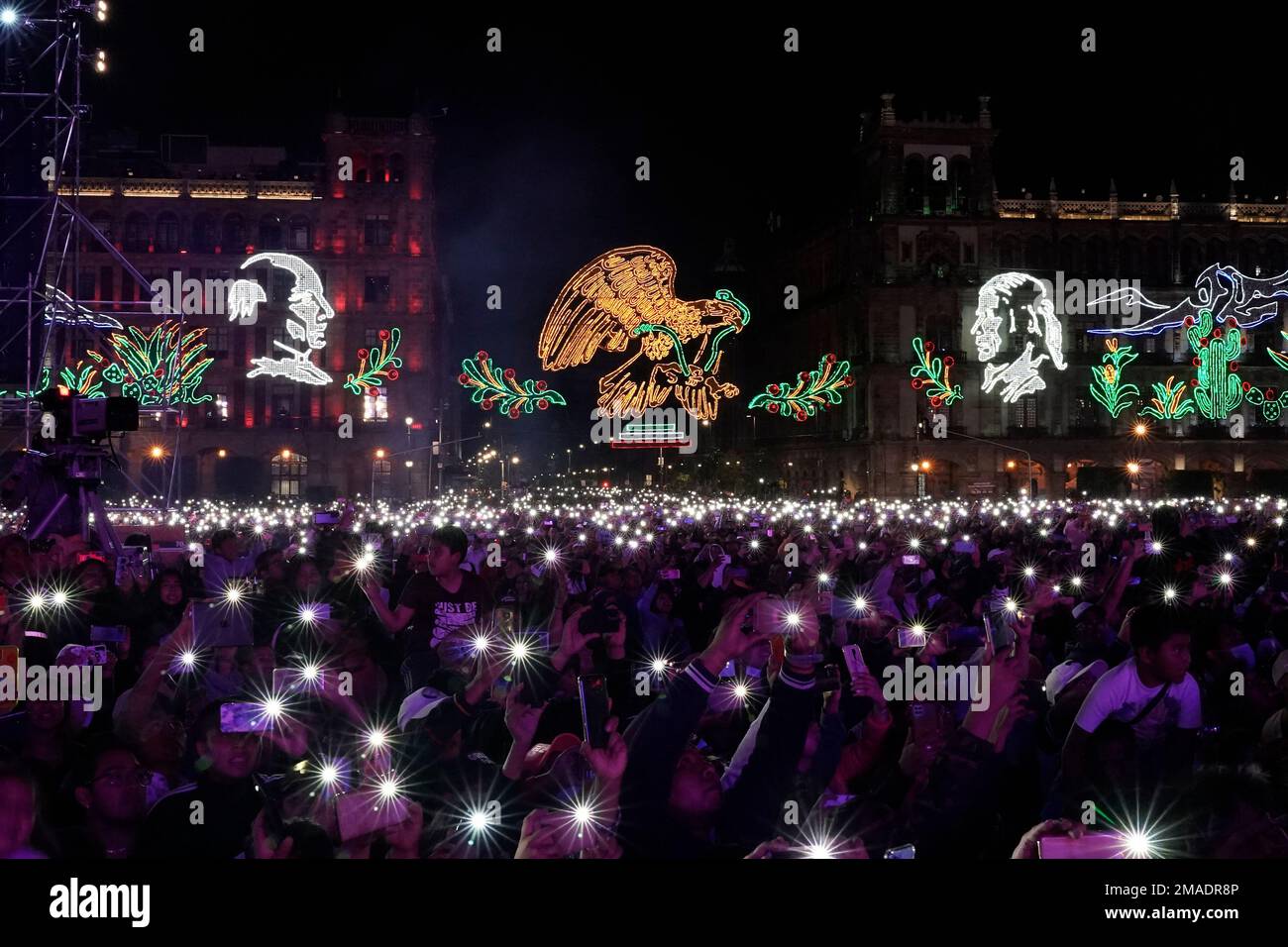 People attend a free concert by the Mexican regional band Grupo Firme ...