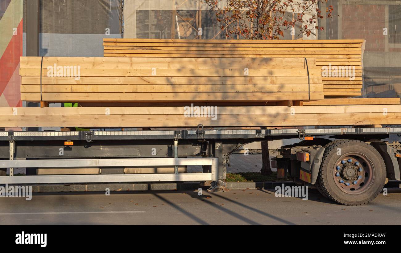 Lumber Wood Material at Flatbed Truck Transport Stock Photo - Alamy