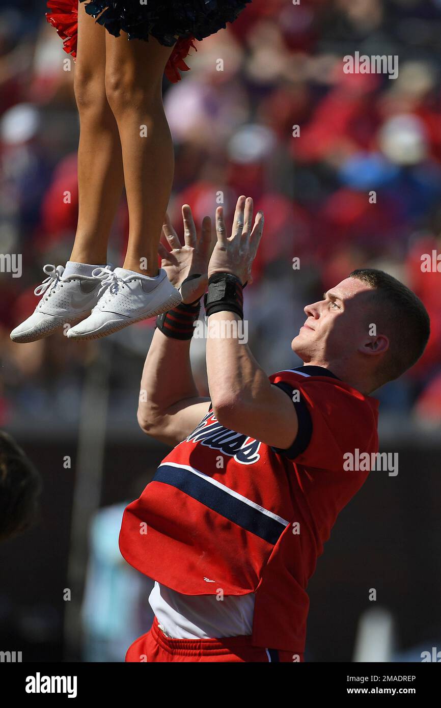 Mississippi cheerleaders perform before the first half of an NCAA ...