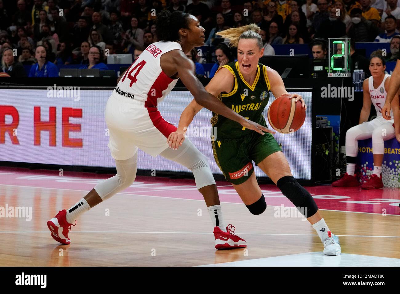 Australia's Tess Madgen runs past Canada's Kayla Alexander, left ...