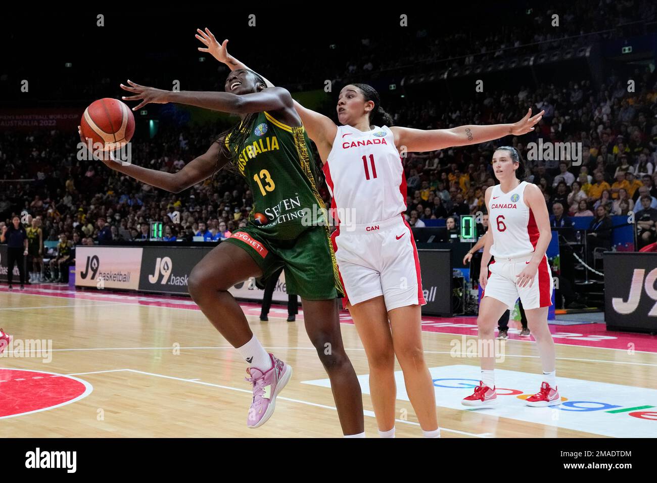 Australia's Ezi Magbegor shoots for goal as Canada's Natalie Achonwa ...