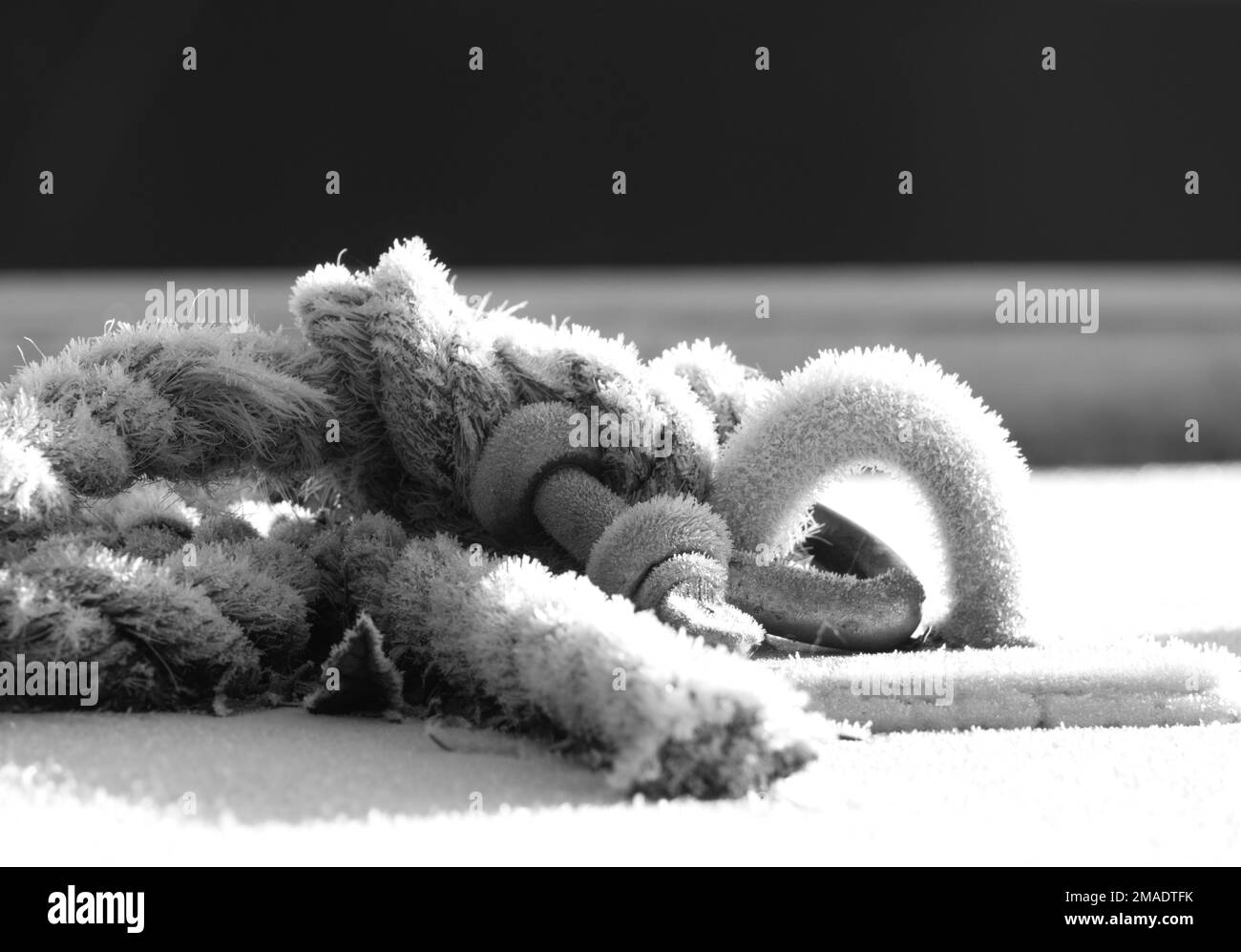 Close up of Icy rope on roof of canal boat Oxford canal black and white ...