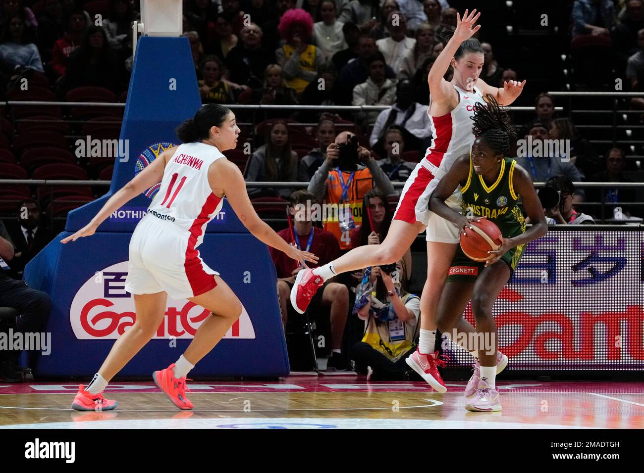 Canada's Natalie Achonwa, and Bridget Carleton attempt to block ...