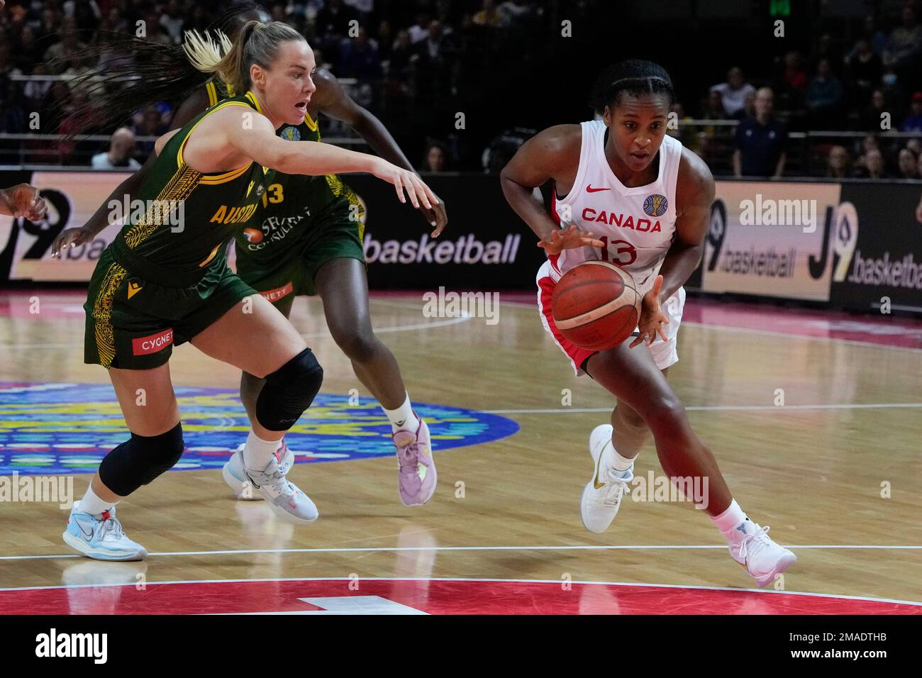 Canada's Shay Colley, runs past Australia's Tess Madgen, left, during ...