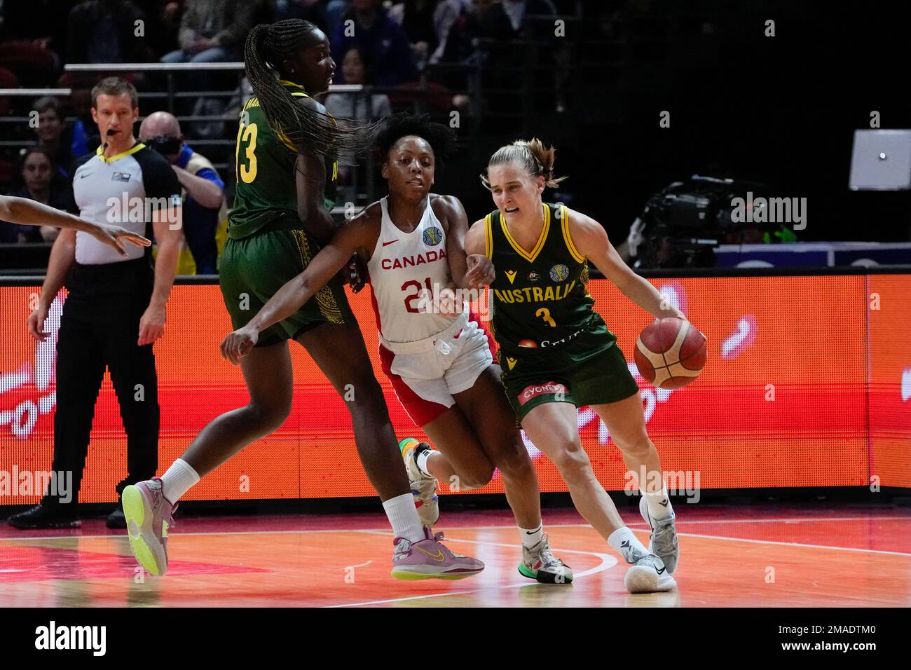 Australia's Kristy Wallace, right, runs past Canada's Nirra Fields ...