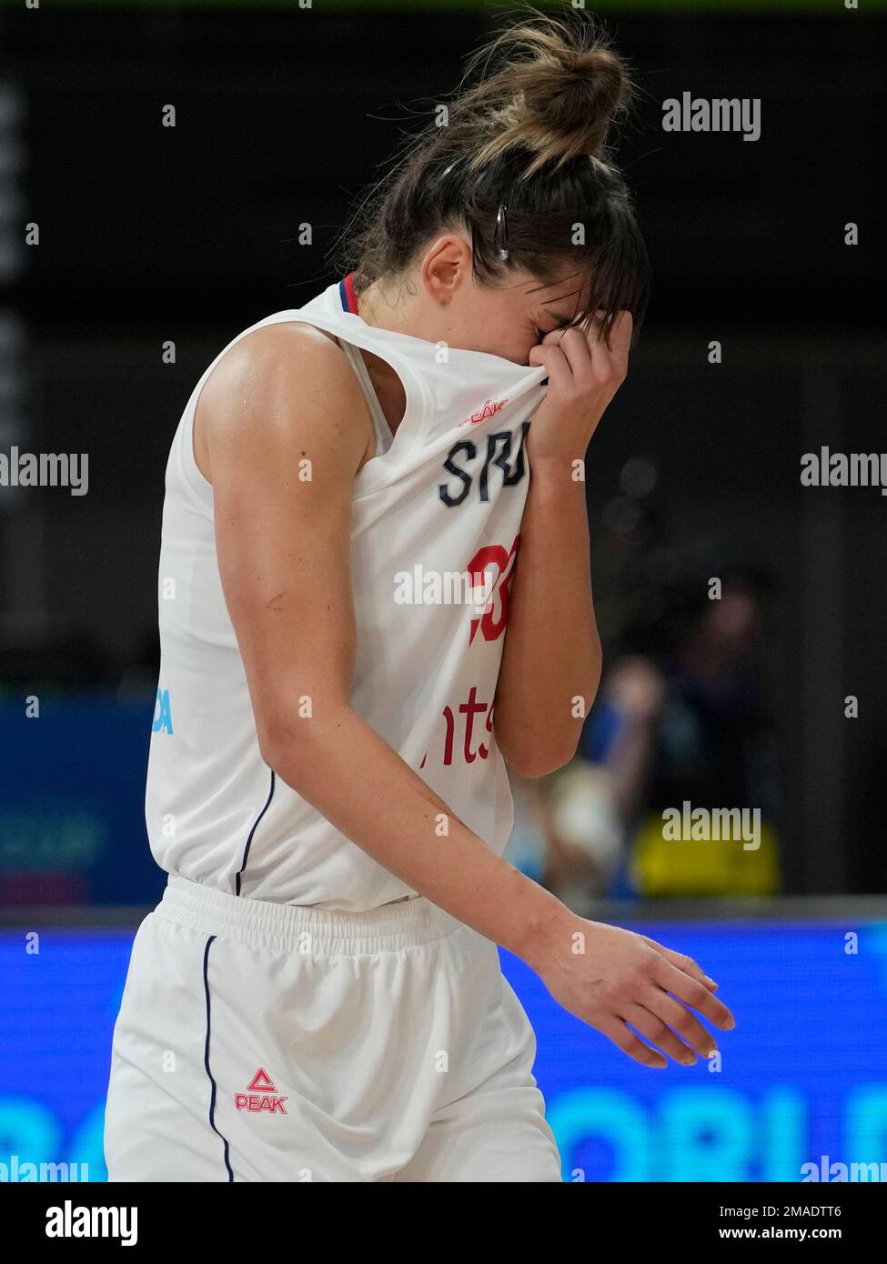 Serbia's Tina Krajisnik covers her face after an injury during their ...