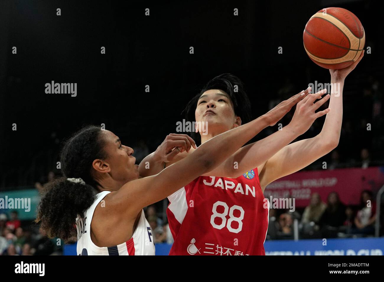 Japan's Himawari Akaho, right, attempts a shot over France's Iliana ...