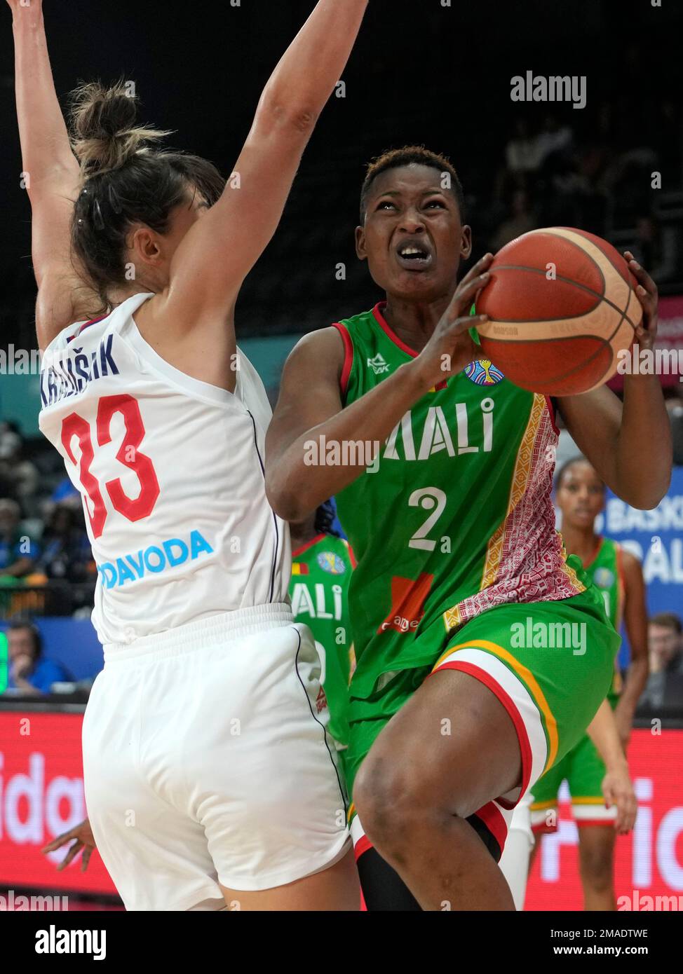 Mali's Salimatou Kourouma, right, is tries to lay up past Serbia's Tina ...