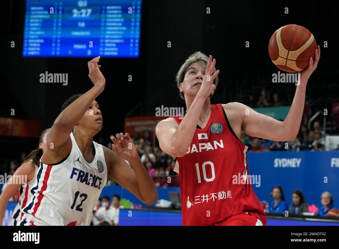 Japan's Ramu Tokashiki, right, attempts shot past France's Iliana ...