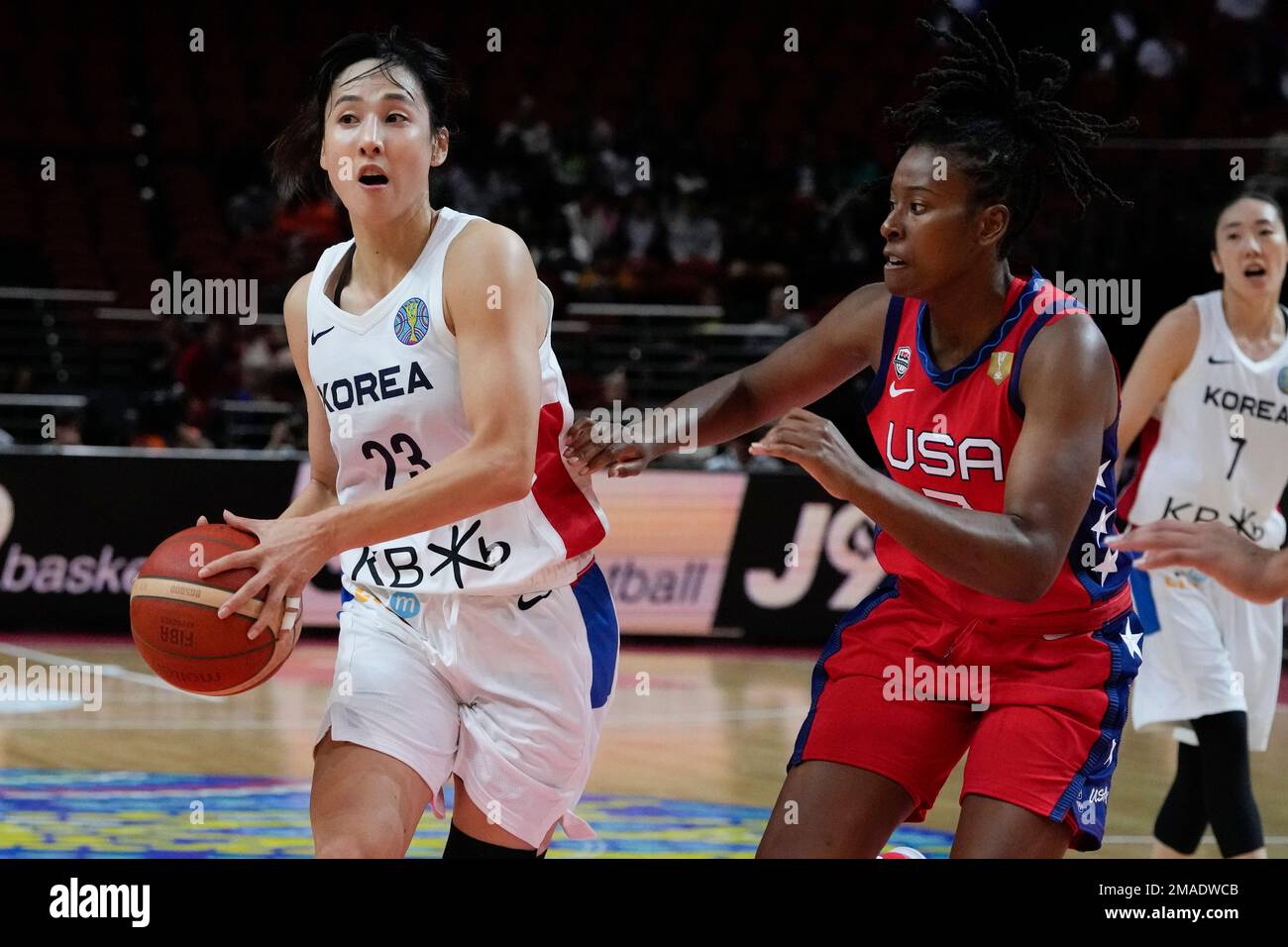 South Korea's Kim Danbi, left, runs past United States' Ariel Atkins ...