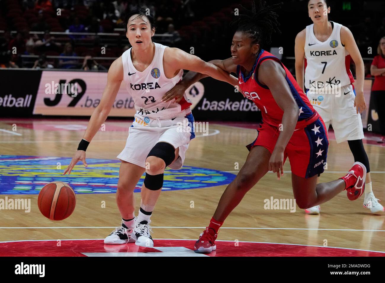 South Korea's Kim Danbi, left, runs past United States' Ariel Atkins ...