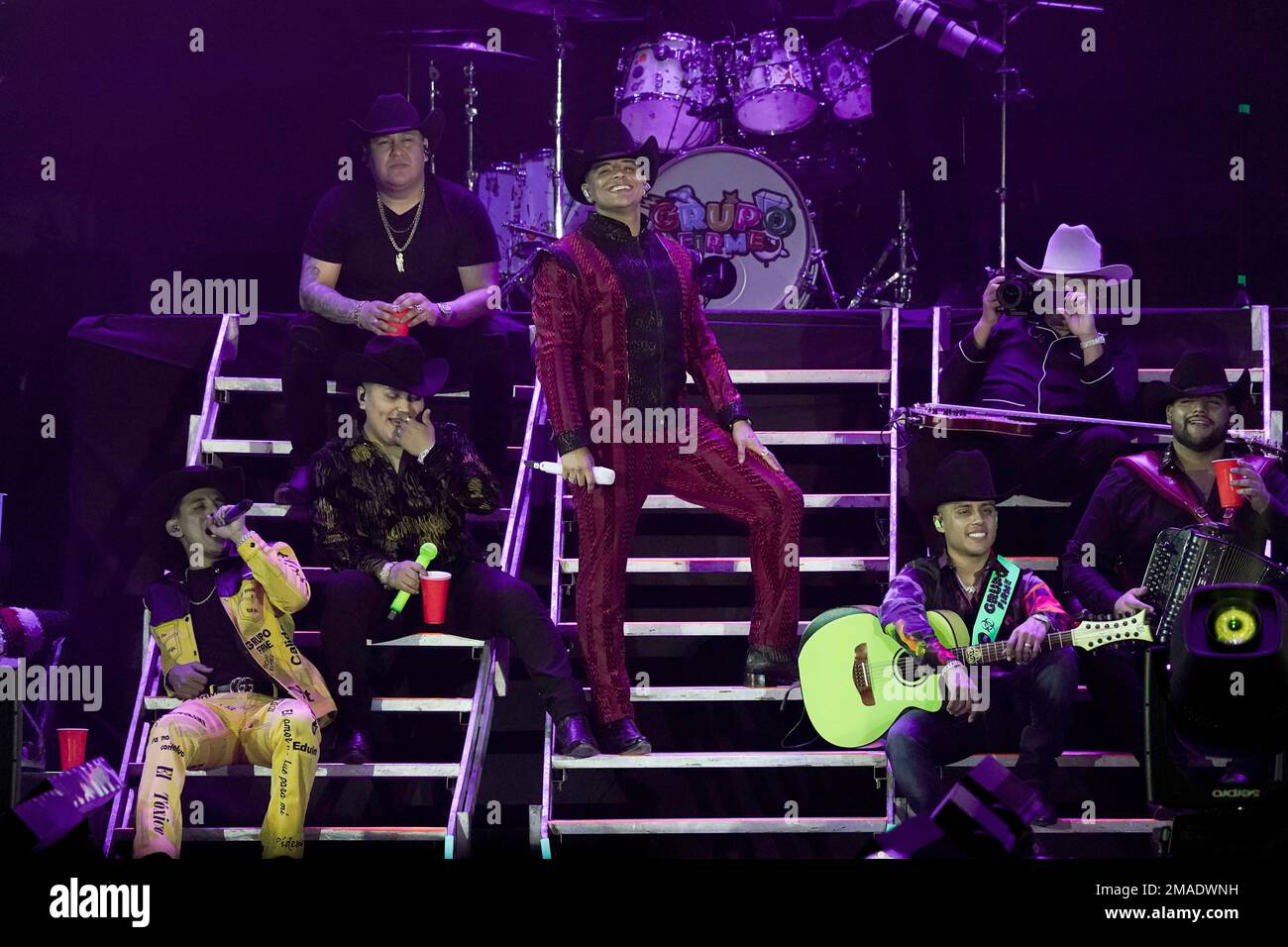 Members of the Mexican regional band "Grupo Firme" perform during a ...